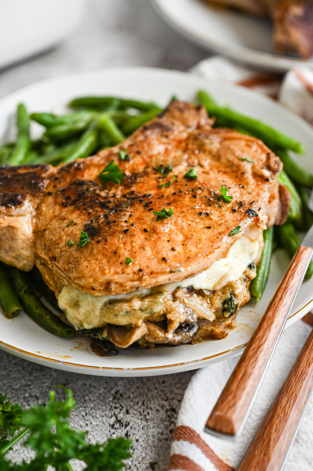 Baked Stuffed Pork Chops - Tender, Juicy & Cheesy!
